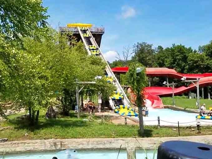 That tower in the distance promises thrills that'll make your stomach drop faster than your phone signal in the Ozarks.