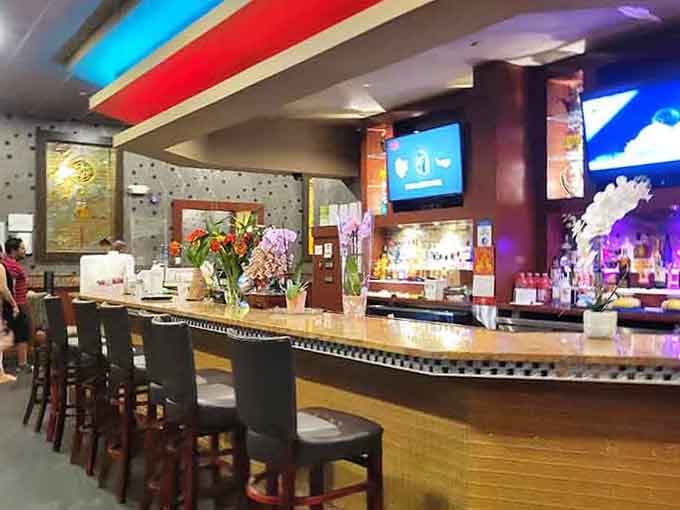 The bar area adds a sophisticated touch where you can contemplate your next strategic plate while sipping something cold.