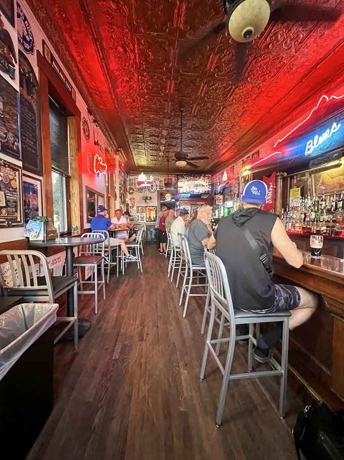 That long wooden bar has heard more stories and served more drinks than most places will in ten lifetimes.