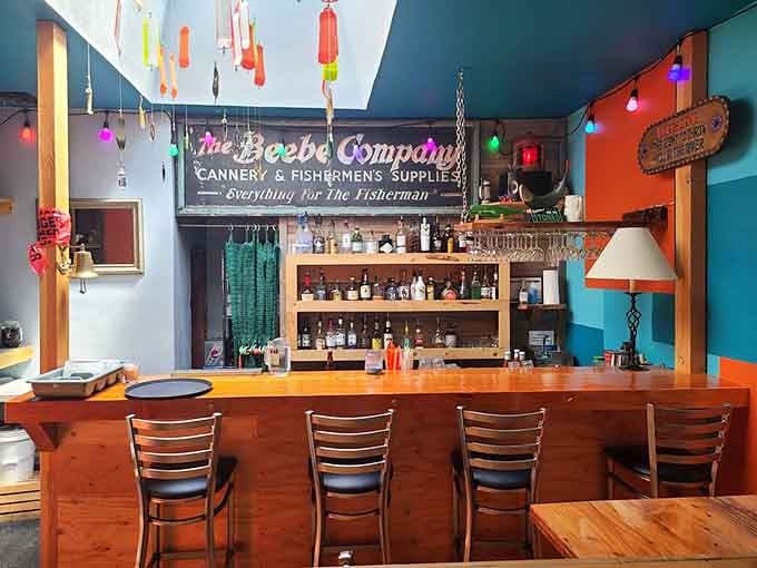 The bar area channels old cannery vibes with colorful buoys overhead and vintage signage telling fishing stories.