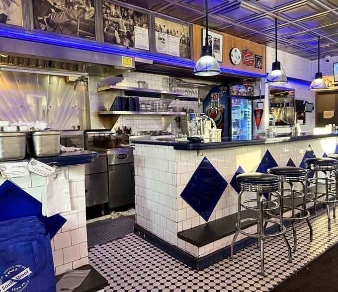 That classic diner counter with blue diamond tile work, where countless conversations and countless eggs have found their home.