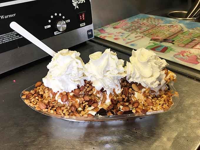 This banana split towers with whipped cream and nuts, defying both gravity and any reasonable portion expectations.