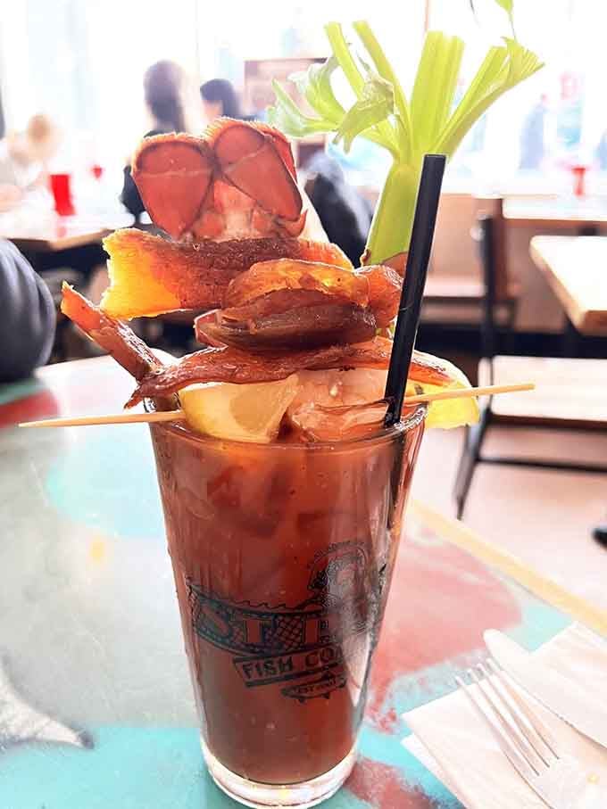 That Bloody Mary isn't just garnished, it's architecturally engineered with lobster, bacon, and pure Wisconsin weekend energy.