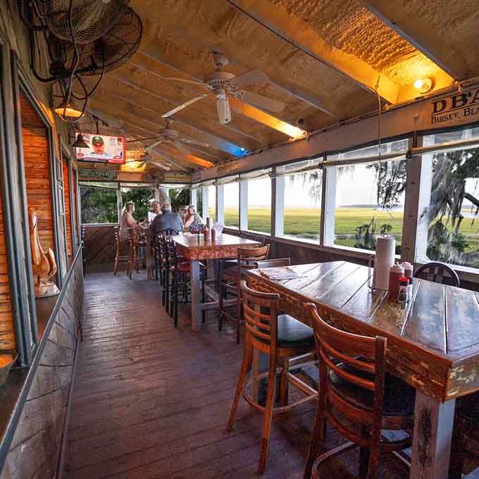 Windows framing marsh views and long wooden tables create the perfect setting for lingering over your third helping.
