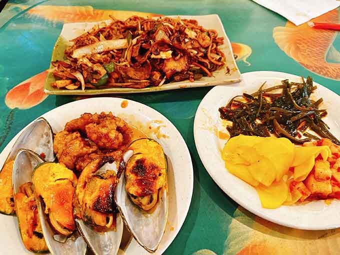 This loaded plate showcases the beautiful chaos of buffet dining, where portion control is just a suggestion.