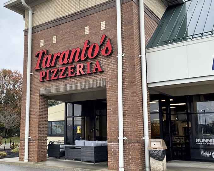 The storefront practically glows with promise, like a beacon calling all hungry souls to cheesy salvation.