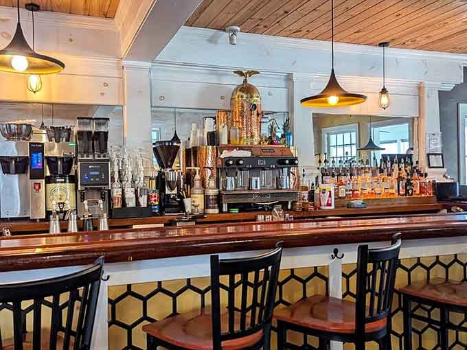 The bar area gleams with copper and promise, ready to elevate your breakfast with something a little special.