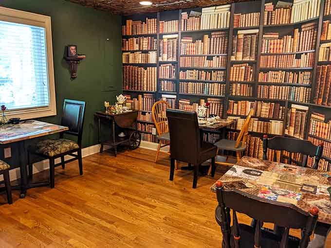 Floor-to-ceiling book wallpaper transforms this dining room into a bibliophile's wildest fantasy come gloriously true.