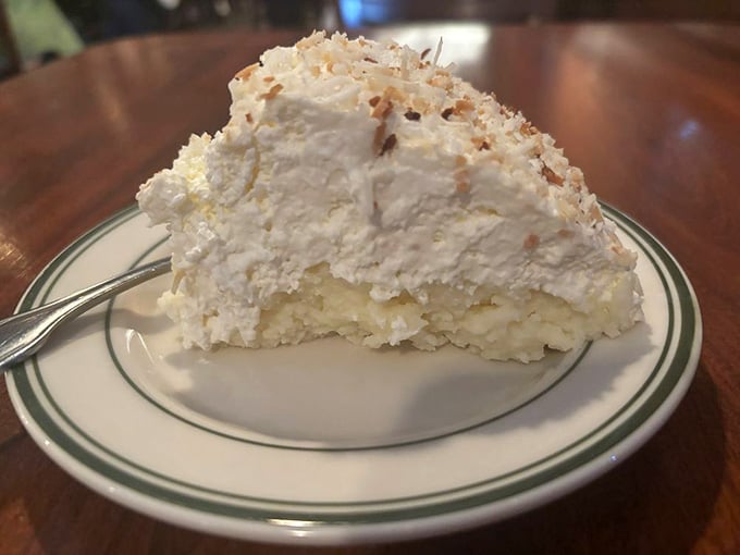 This coconut cream pie towers higher than most people's retirement dreams and tastes infinitely better than any investment.