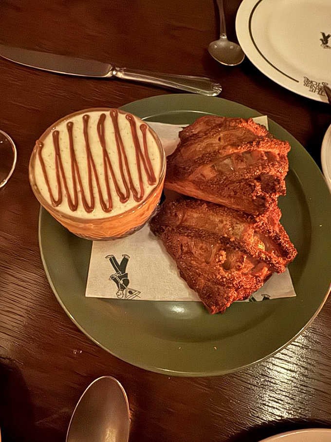Apple hand pies with that perfect golden crust, served warm alongside what appears to be the world's most photogenic dessert companion.
