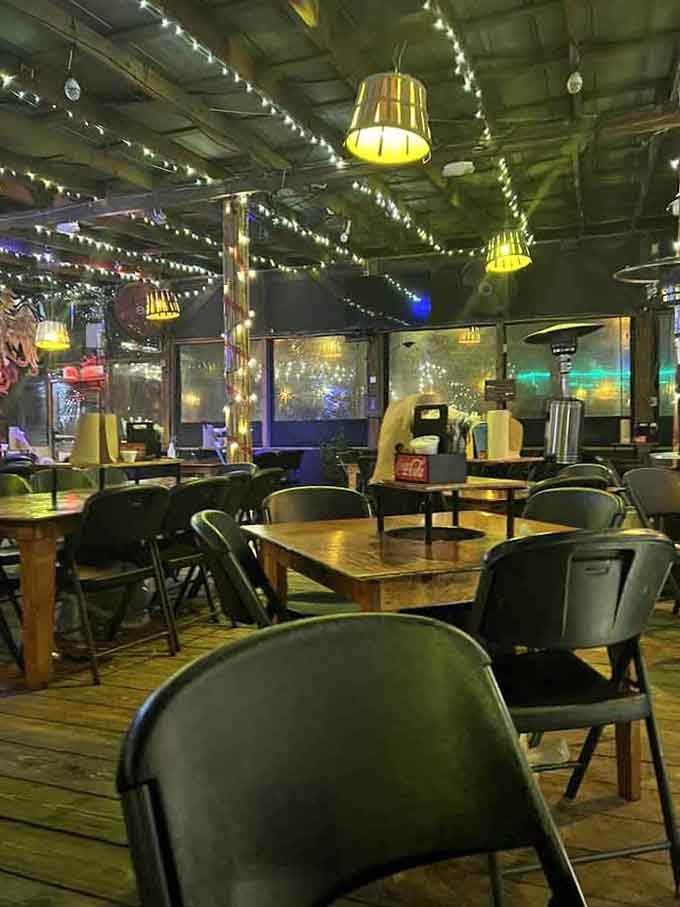 Tables waiting patiently under string lights for the next wave of hungry seafood enthusiasts to arrive.