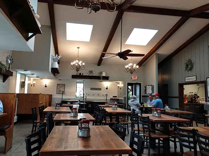 Those exposed beams and skylights create an airy, welcoming space that feels both rustic and surprisingly elegant at once.