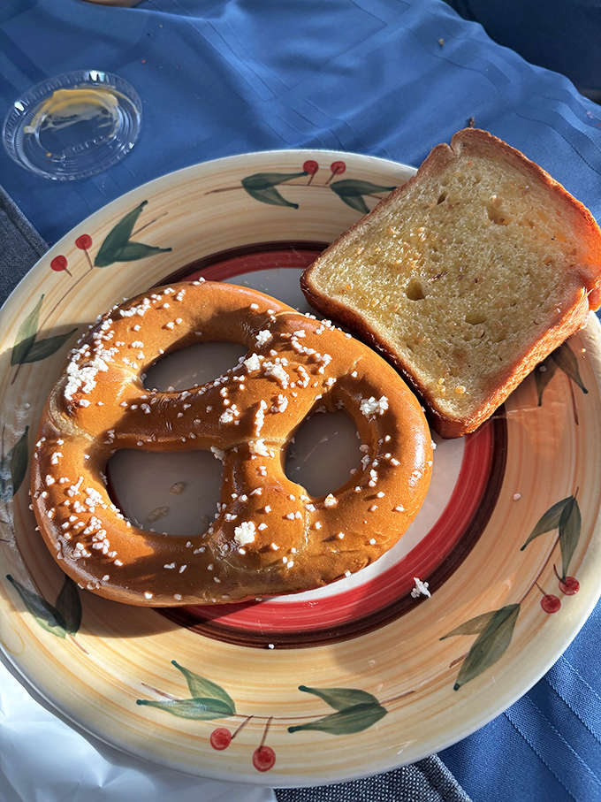 Giant pretzel with garlic toast proving that even the sides deserve attention at a proper seafood shack.