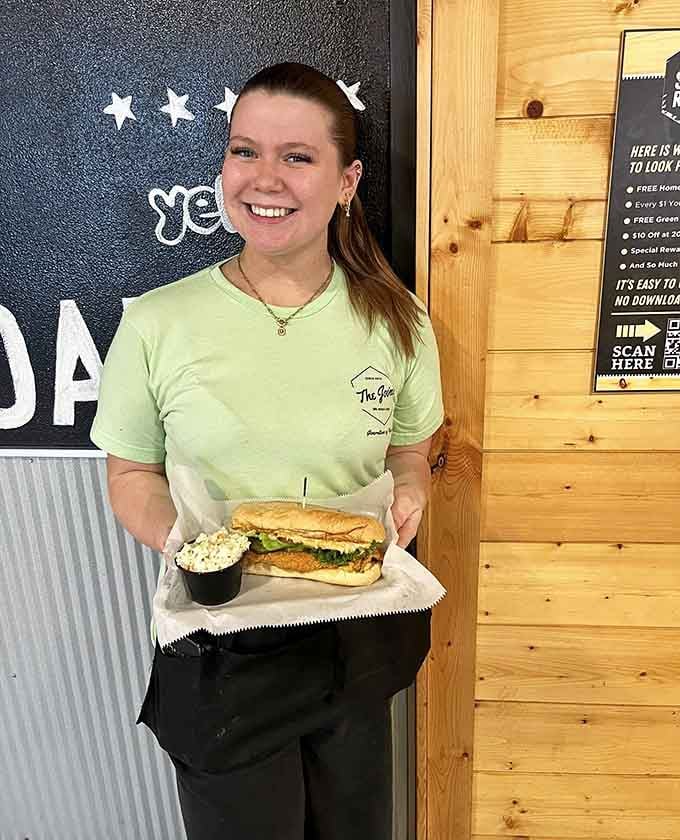 Friendly faces serving up smiles alongside sandwiches, because hospitality matters as much as the meat itself.