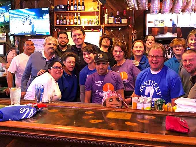 The smiling faces behind the bar represent the heart of The Ketch, where friendly service meets serious seafood expertise.