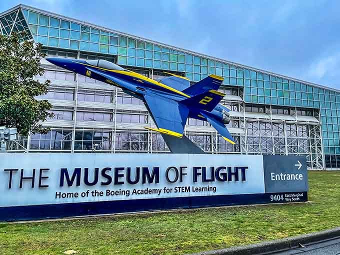 The museum entrance promises adventure, with a Blue Angels jet dramatically mounted outside like a frozen acrobatic maneuver.