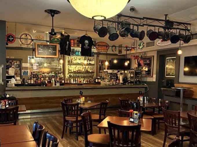 The bar beckons with its impressive bottle selection and that inviting glow only proper taverns can achieve.