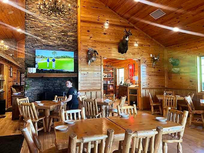 Stone fireplace, mounted wildlife, and enough wood paneling to make a lumberjack weep tears of pure aesthetic joy.