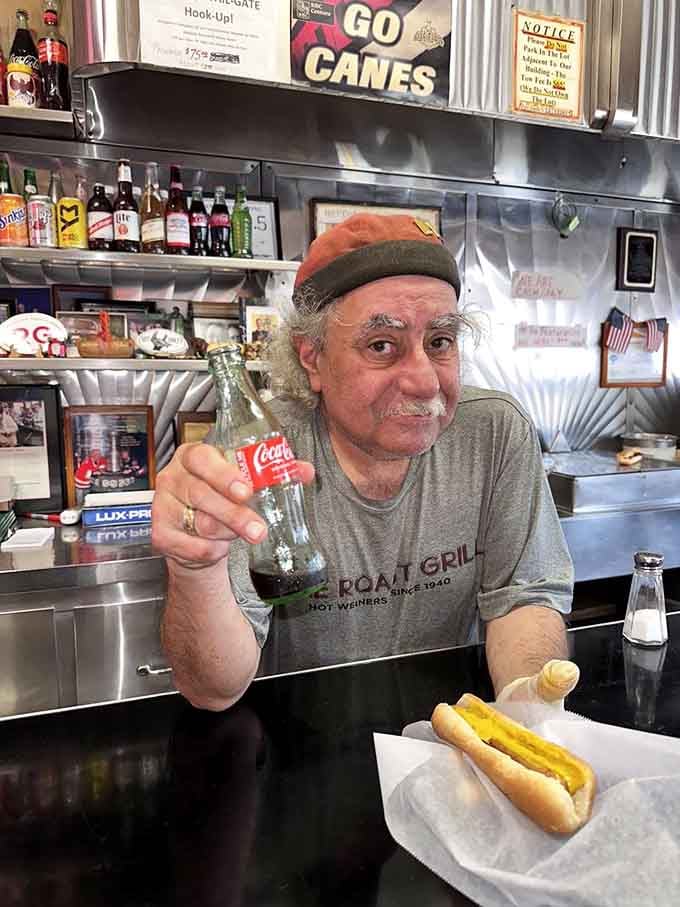 The friendly face behind the counter, serving happiness wrapped in wax paper with genuine Raleigh hospitality and pride.