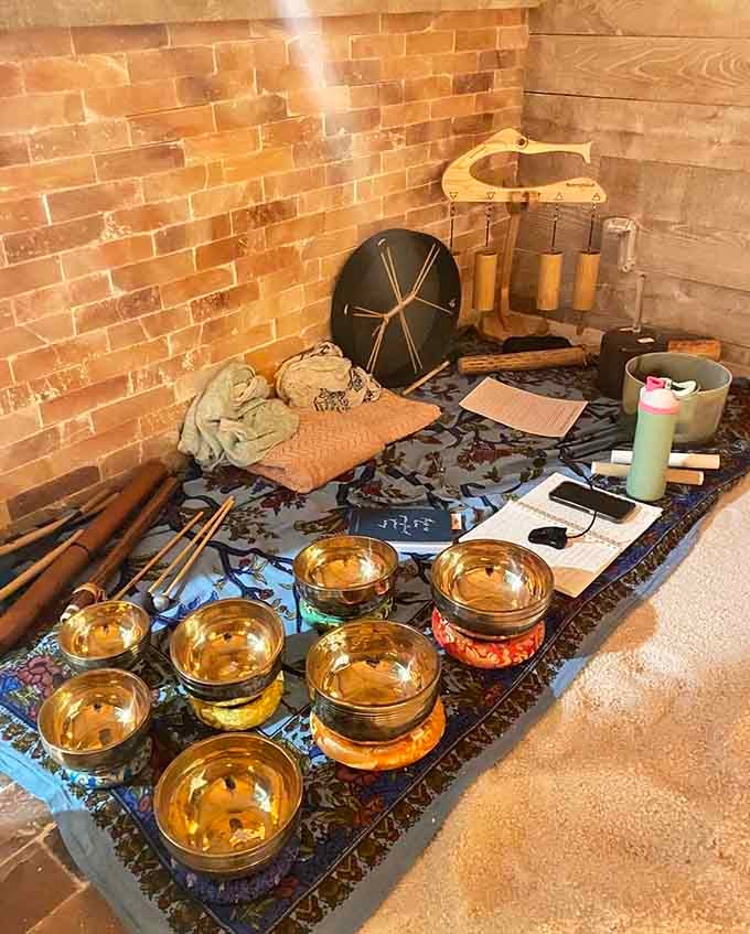 Singing bowls and meditation tools arranged on salt create a wellness toolkit that would impress even the most dedicated yoga enthusiast.