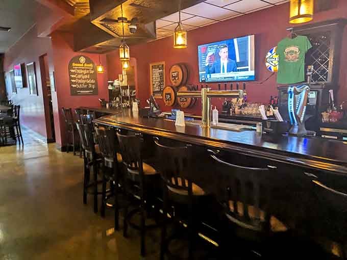 The bar area features warm wood tones and plenty of screens, perfect for catching the game or avoiding conversation.