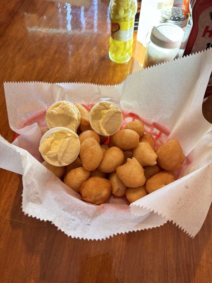 Those golden hush puppies with butter are the reason people lose count of how many they've actually eaten.