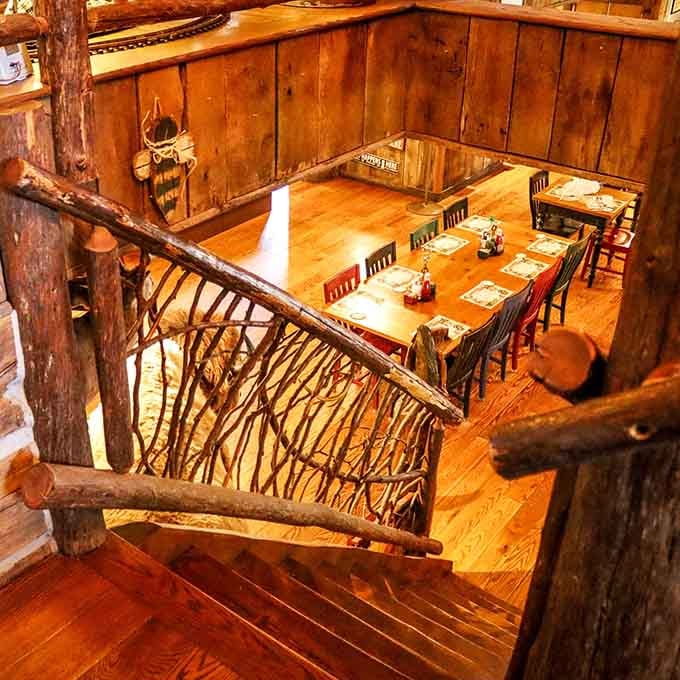 That rustic staircase and warm wood tones make you want to claim a table and never leave.
