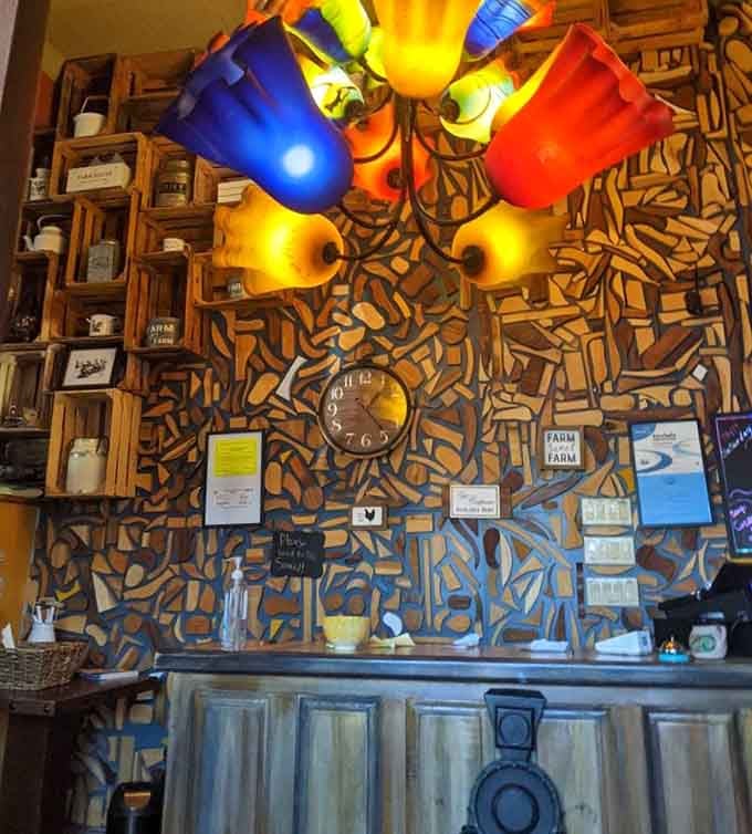 That host station wall covered in vintage tools and colorful watering cans shows someone's got serious creative flair and whimsy.