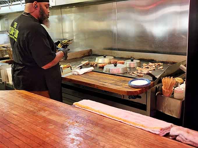 Behind the scenes, the kitchen operates with the efficiency of people who've made approximately one million burgers.