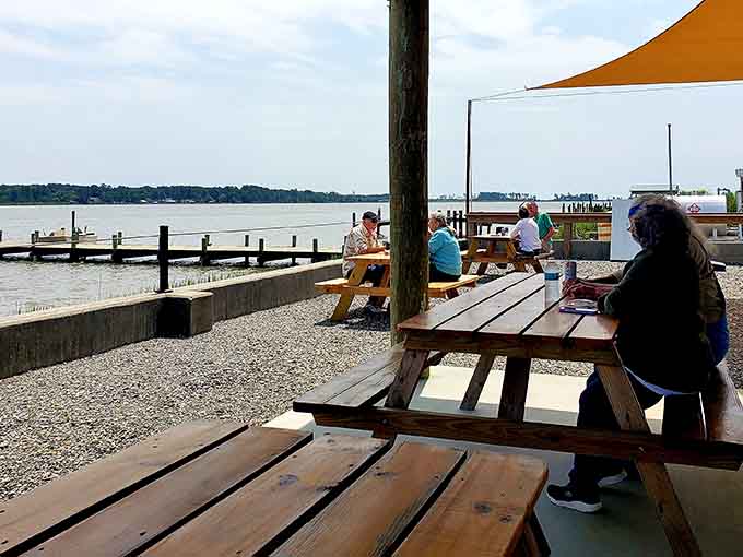 Picnic tables facing the water where the only dress code is "bring your appetite and relax."