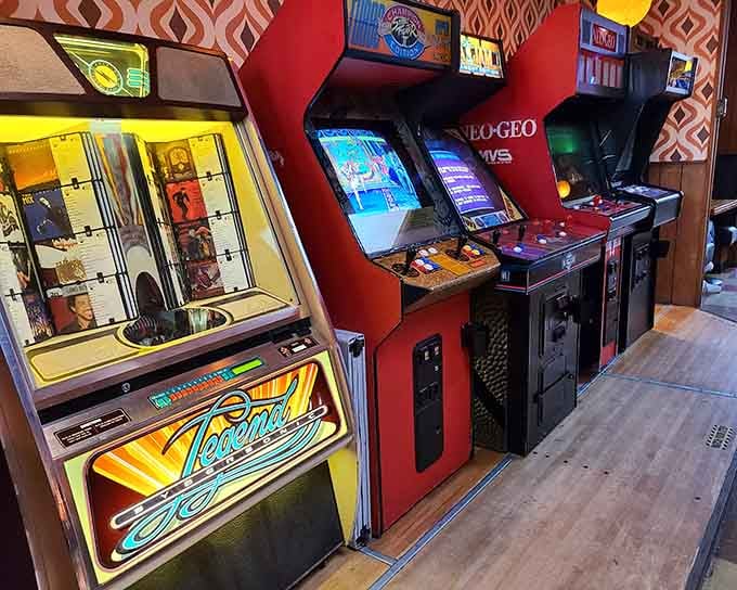 Vintage arcade cabinets line up like soldiers ready for battle, each one a portal to simpler gaming times.
