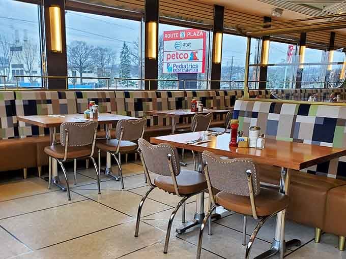 Modern geometric booth dividers add contemporary flair while maintaining that timeless diner atmosphere we all crave deep down inside our souls.
