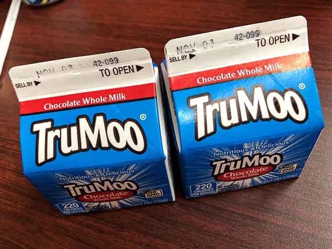 TruMoo chocolate milk cartons on the table&mdash;because sometimes the best beverage pairing is pure nostalgic simplicity.