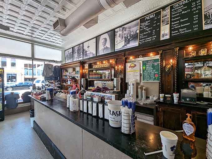 Historic photographs line the walls, showing this place hasn't changed much, and that's the point.