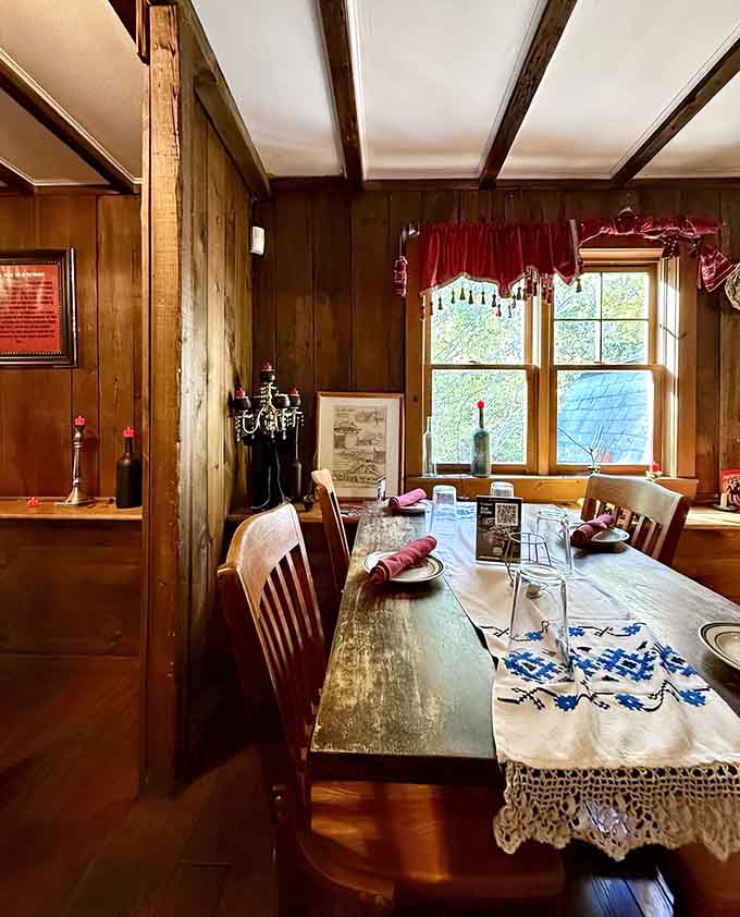 Sunlit window seats offer intimate dining spots where Old World charm meets New England's natural beauty outside perfectly.