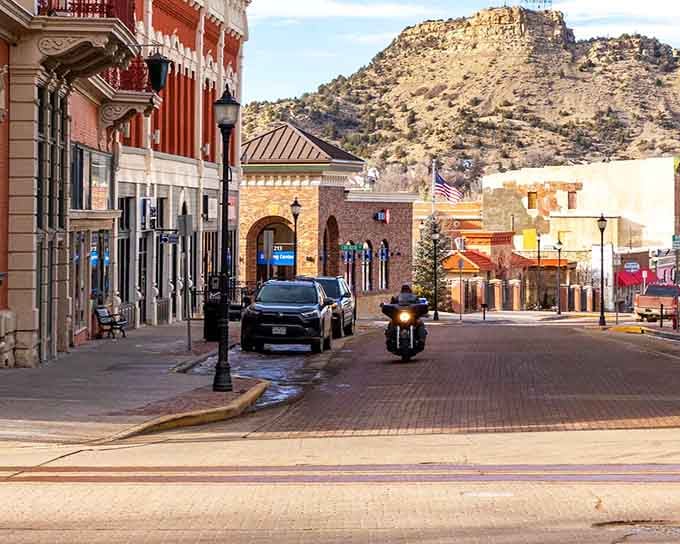 The downtown view at golden hour showcases church spires and historic buildings bathed in that perfect Colorado light.