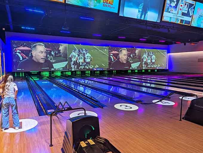 Bowling lanes with massive screens because apparently regular bowling wasn't entertaining enough for the modern era.