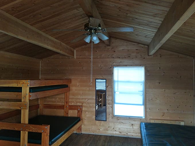 Rustic cabin interiors with bunk beds bring back summer camp memories, but with better mattresses and fewer mosquitoes.