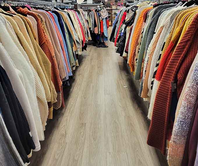 Sweater section looking like a cozy hug factory, with textures ranging from chunky knits to sleek cardigans.