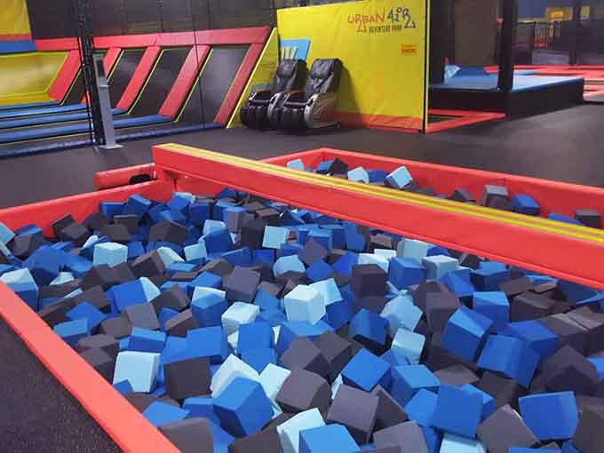 Battle Beam foam pit awaits below, ready to catch defeated warriors with soft, forgiving embrace and dignity.