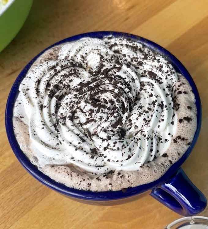 That hot chocolate is topped with enough whipped cream to make you wonder if it's dessert or a beverage, then decide it's both.