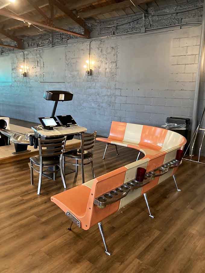 Those orange and white benches have supported more dreams, defeats, and pizza breaks than we can count.