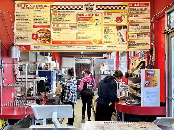 The crew behind the counter, orchestrating burger magic with the efficiency of a well-oiled machine.