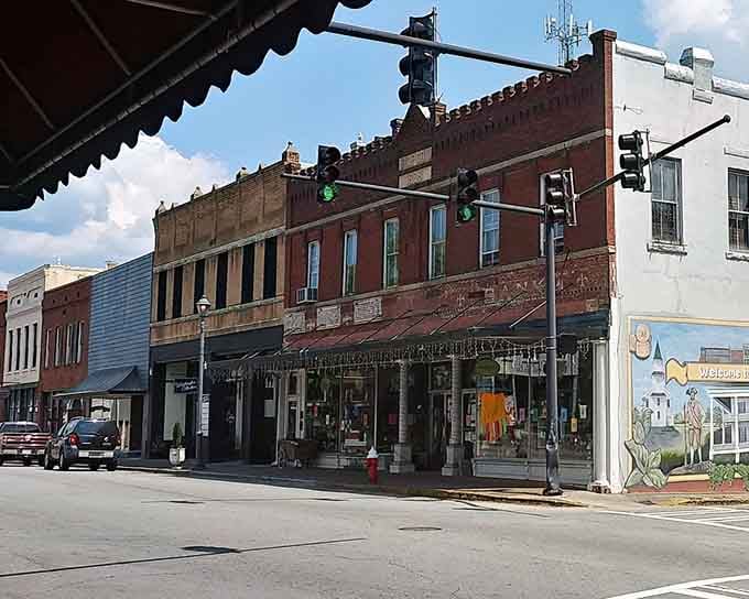 Ornate cornices crown these commercial buildings like fancy hats at a garden party, each detail lovingly maintained through generations.