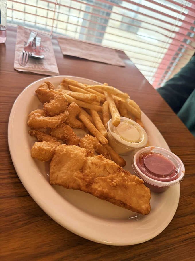 Golden fried fish with crispy fries, proving this cafe handles lunch just as brilliantly as breakfast.