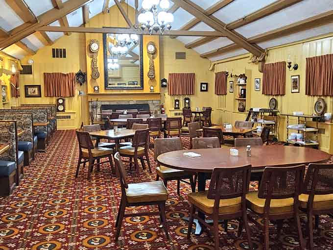 Yellow walls and wagon wheel chandeliers create that farmhouse vibe your grandmother would absolutely approve of wholeheartedly.