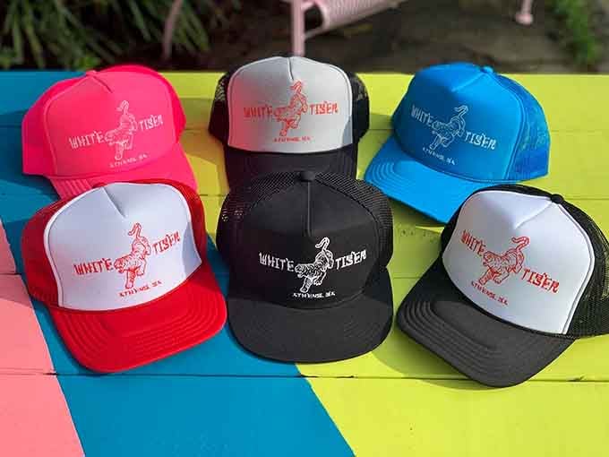 White Tiger trucker hats in every color because why shouldn't your head advertise great food with style?