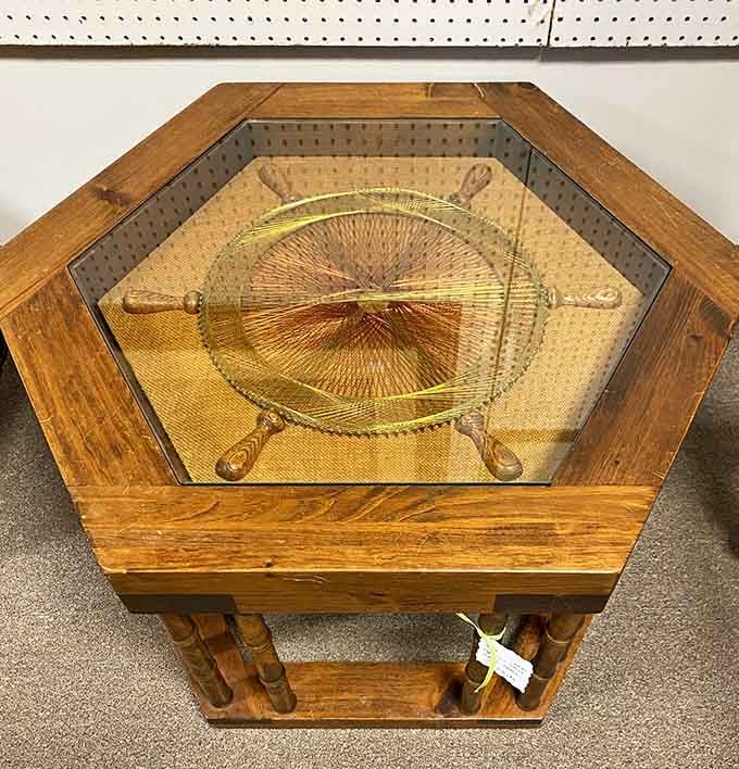 That hexagonal table with glass top screams mid-century sophistication louder than Don Draper's entire wardrobe.