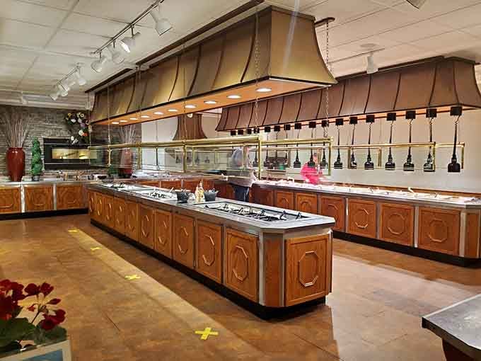 The buffet line stretches impressively long, with warming stations keeping everything fresh for your multiple inevitable return trips today.