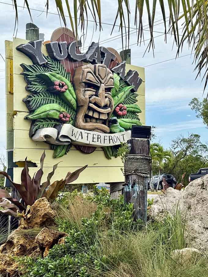 The tiki-themed signage surrounded by tropical plants makes finding this place feel like discovering a secret island hideaway off the highway.